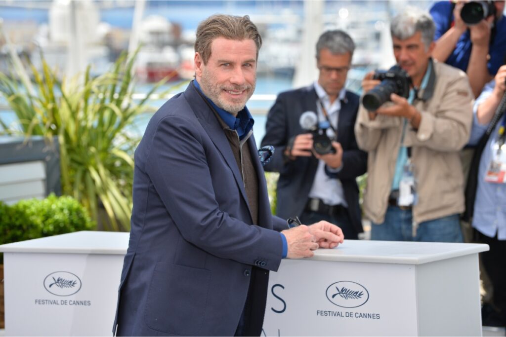 John Travolta Turns Heads At Cannes 2026 With A Dark Beard And A White